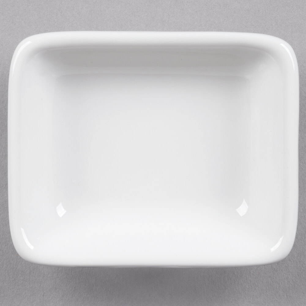 Tuxton BPZ-033B DuraTux 2 oz. Bright White Rectangular China Sauce Dish - 48/Case