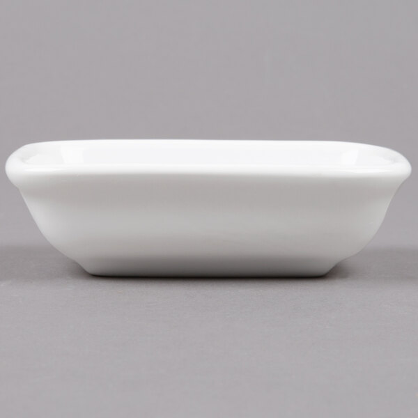 Tuxton BWZ-040B DuraTux Healthcare 4 oz. Bright White Rectangle China Sauce Dish - 24/Case