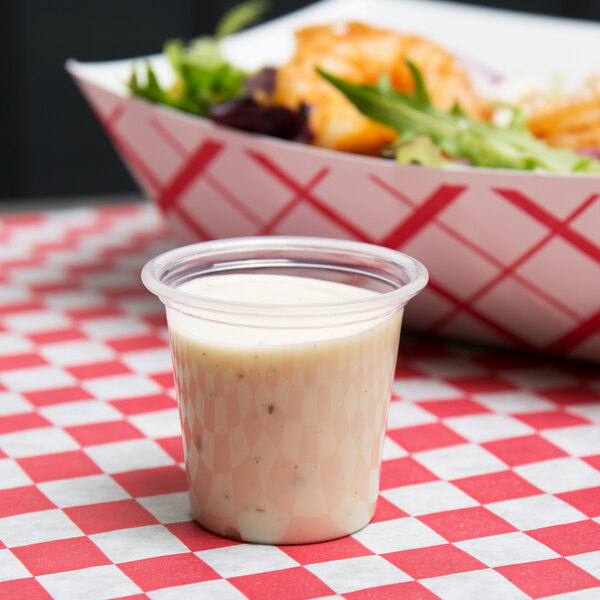 Choice 1.25 oz. Clear Plastic Souffle Cup / Portion Cup - 100/Pack