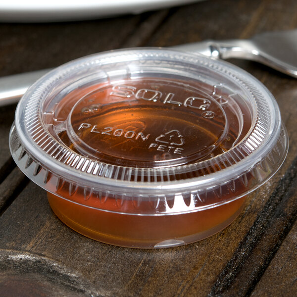 Solo PL200N Medium Clear Plastic Souffle / Cup Lid - 125/Pack