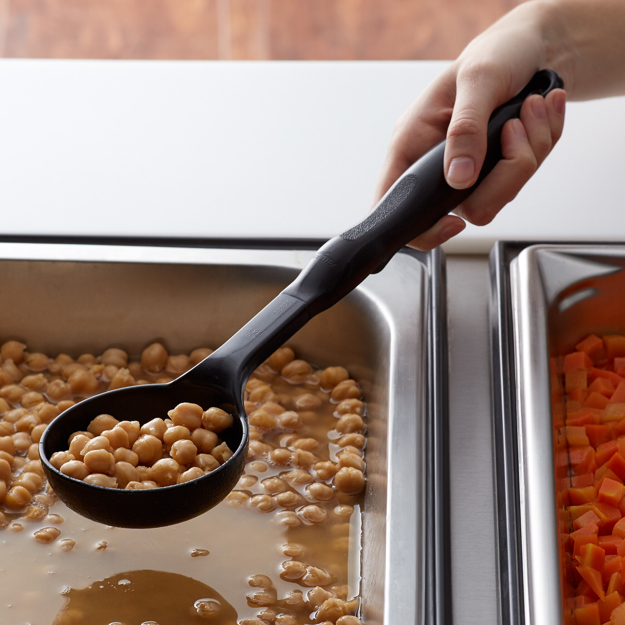 Vollrath 5283820 4 oz. Black High Heat Perforated Round Nylon Spoodle ...